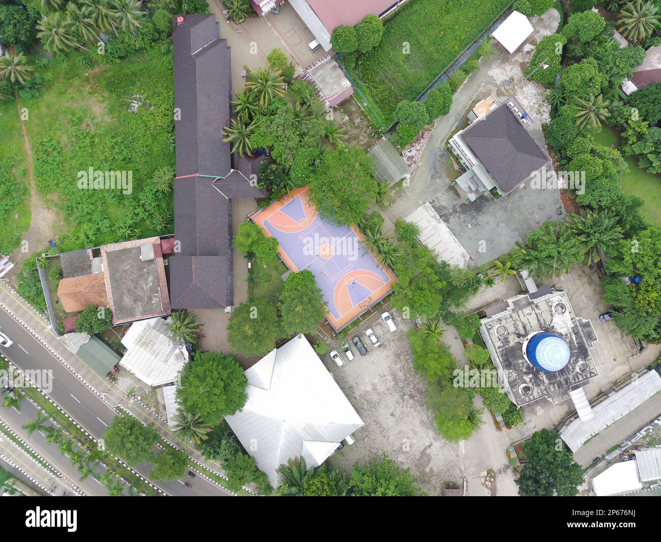 Aerial view of a basketball court that has beautiful color patterns ...
