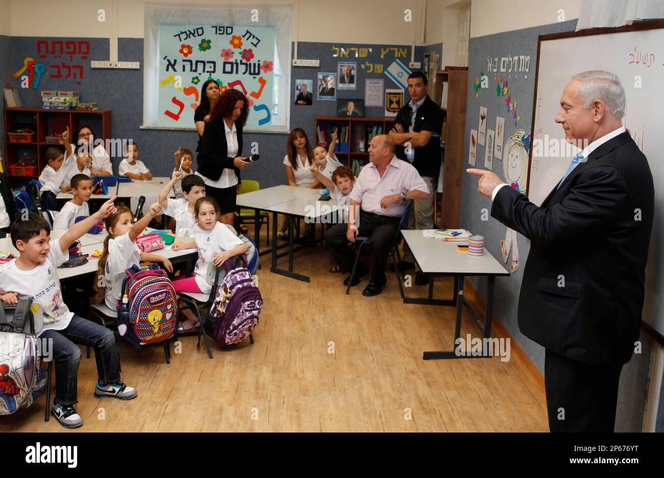 Israeli Prime Minister Benjamin Netanyahu speaks with first grade ...