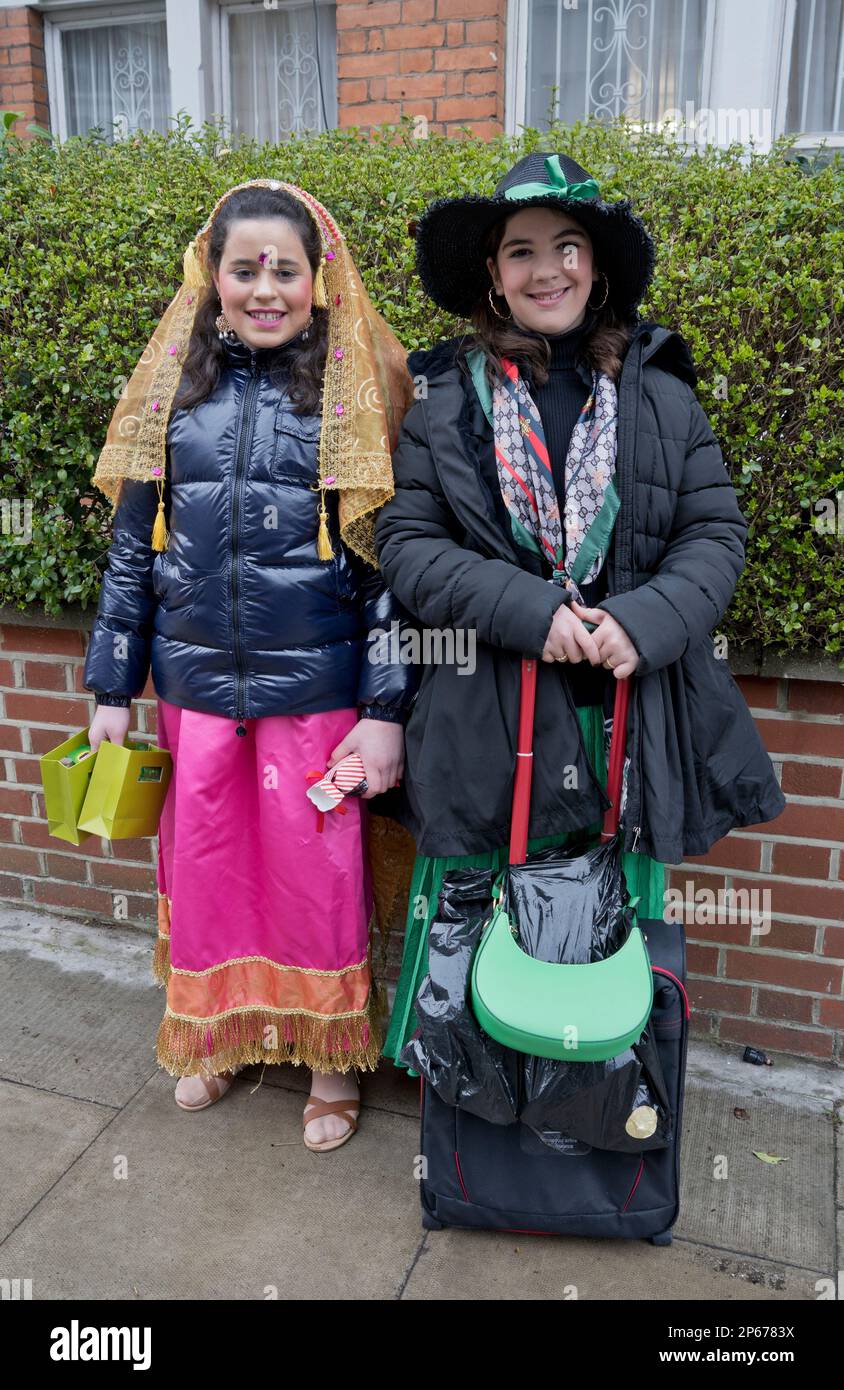 Children in fancy dresses and costumes to celebrate Jewish Purim ...