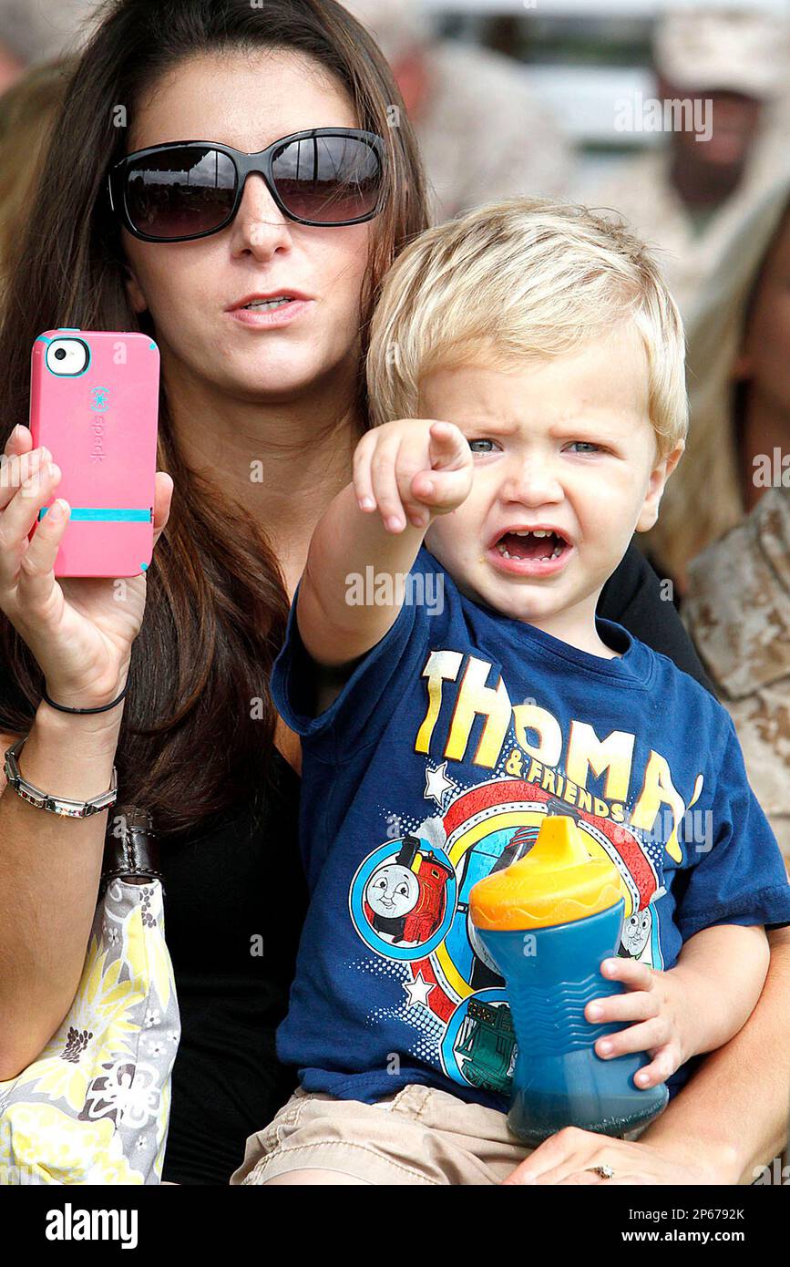 Nicole Lentz shoots video while holding her son Collin Lentz during the ...