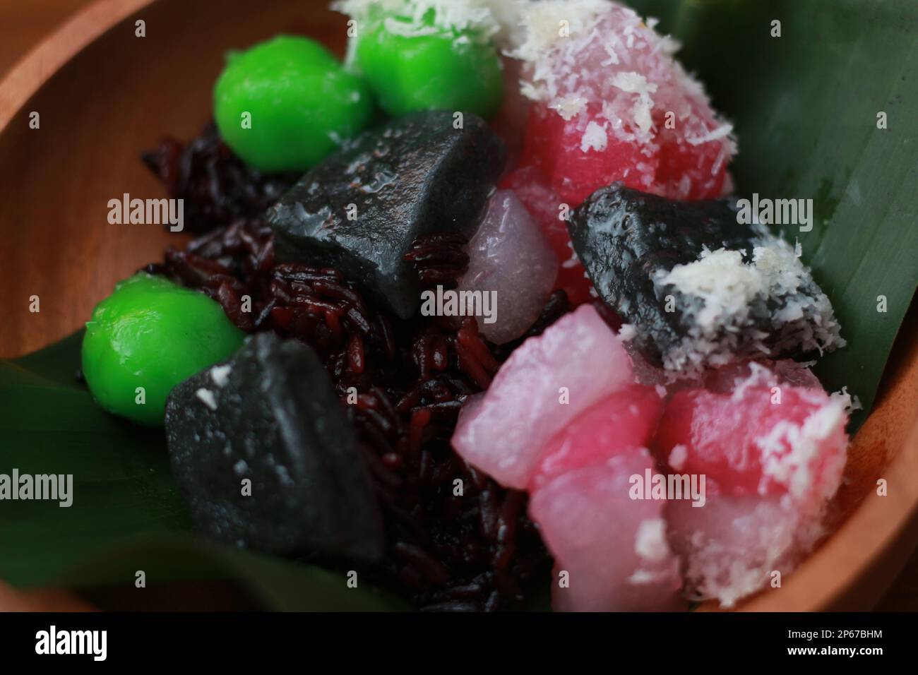 a close up of a traditional Indonesian food called Cenil. has a bright ...