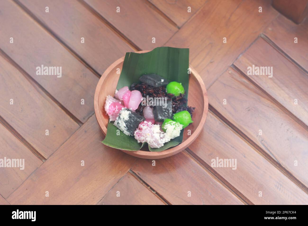 a close up of a traditional Indonesian food called Cenil. has a bright ...