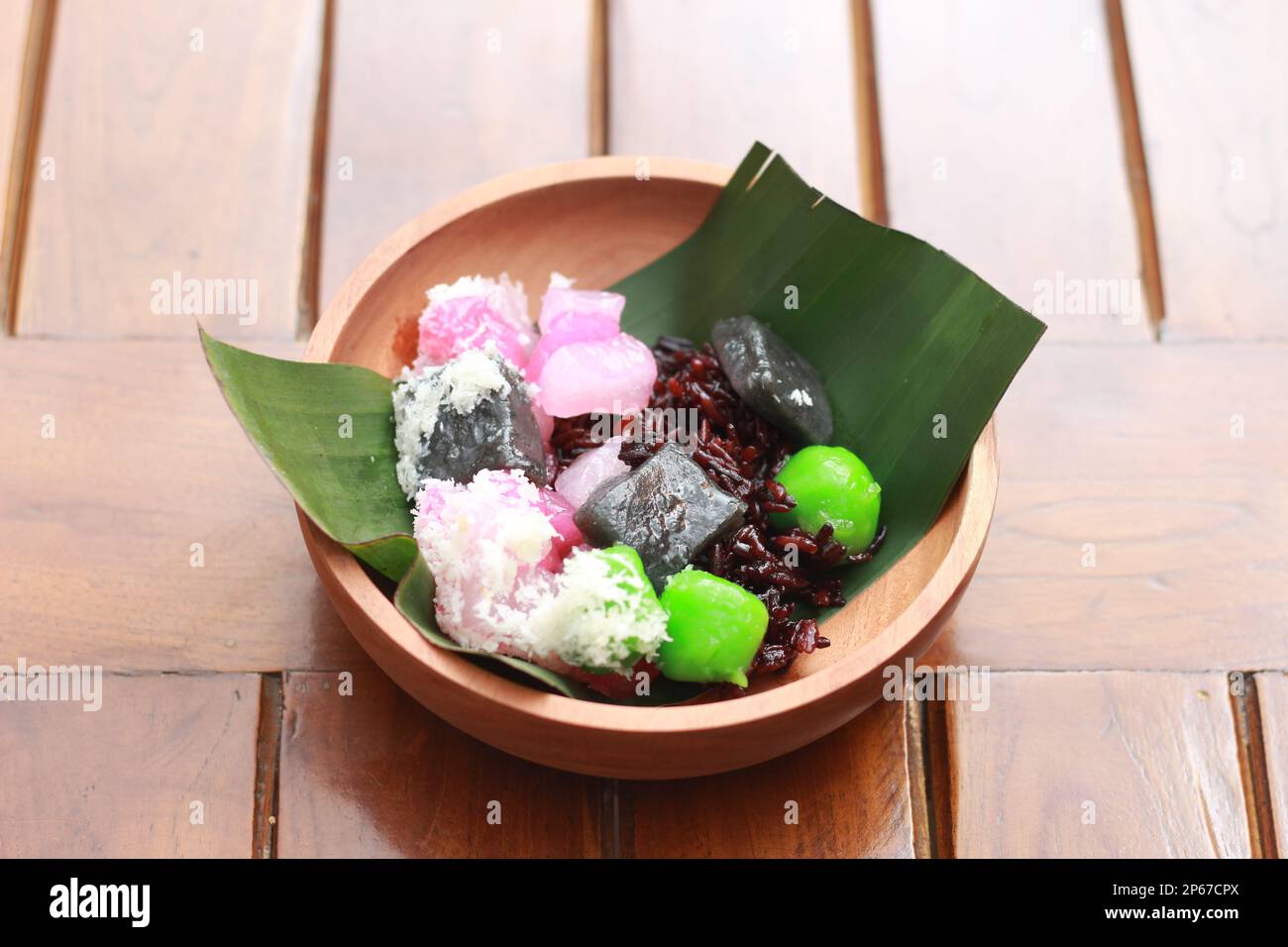 a close up of a traditional Indonesian food called Cenil. has a bright ...