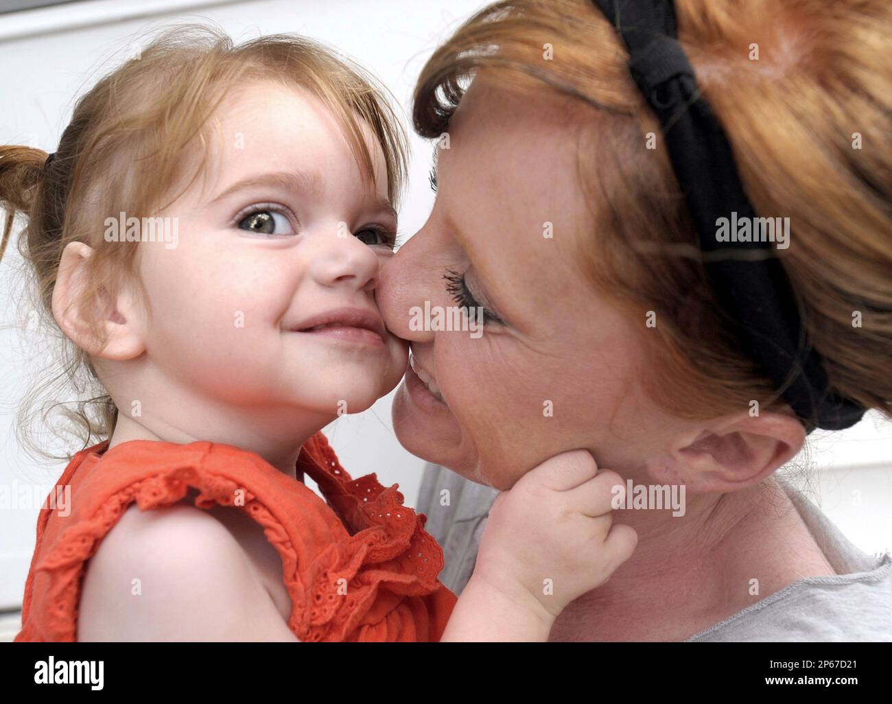 In this July 30, 2012 photo, Ramee Larson holds her 2-year-old daughter ...