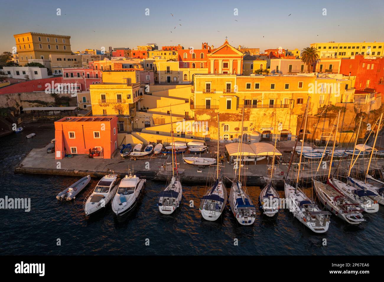 Aerial view of the harbour of the colourful village of Ventotene at ...
