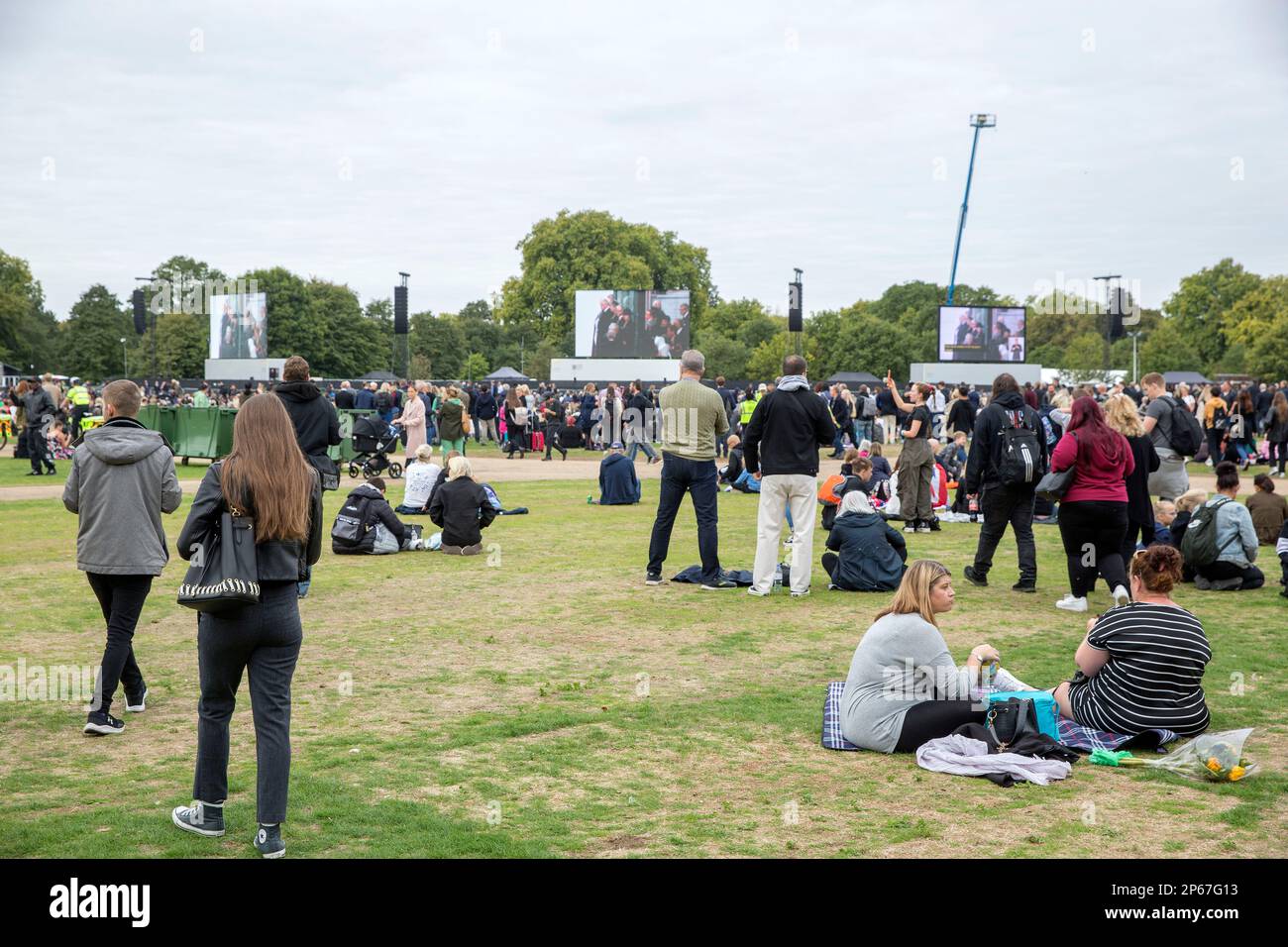 People gather in Hyde Park, London, where the TV coverage of the late ...