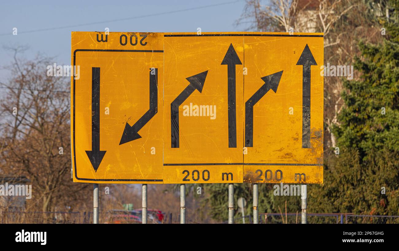 Confusing Direction Arrows Road Sign at Yellow Background Stock Photo ...