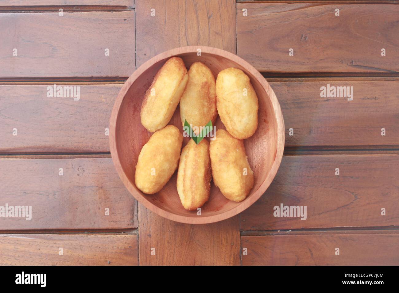 Comro or combro, a traditional Javanese snack made of deep fried grated ...
