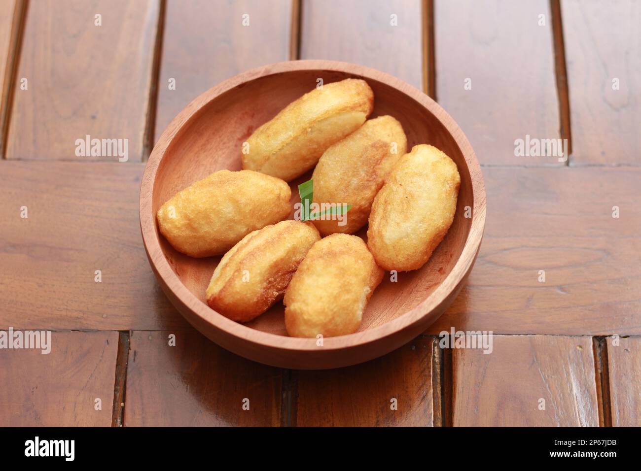 Comro or combro, a traditional Javanese snack made of deep fried grated ...