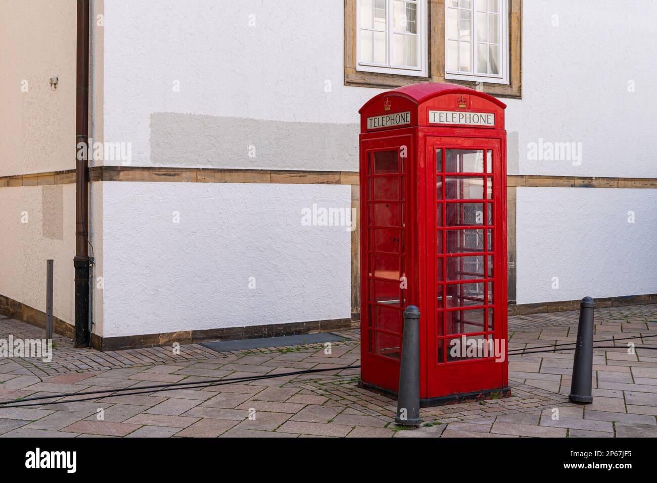 Old red telephone booth in English style on a deserted street Stock ...