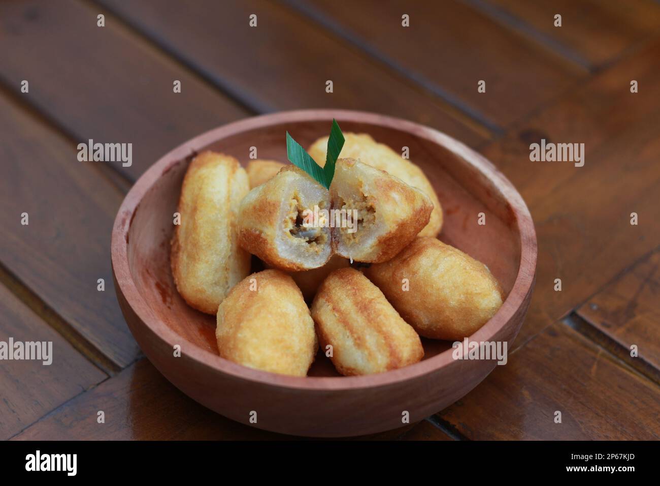 Comro or combro, a traditional Javanese snack made of deep fried grated ...