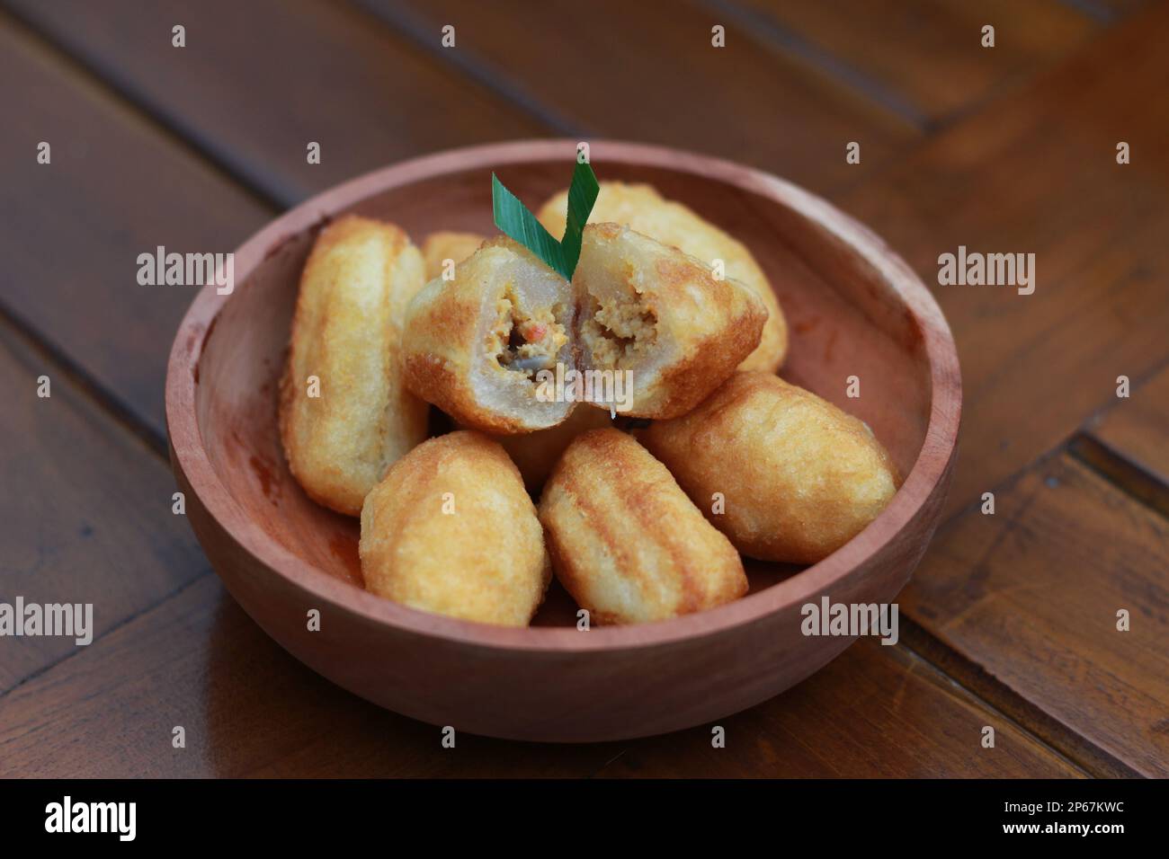 Comro or combro, a traditional Javanese snack made of deep fried grated ...