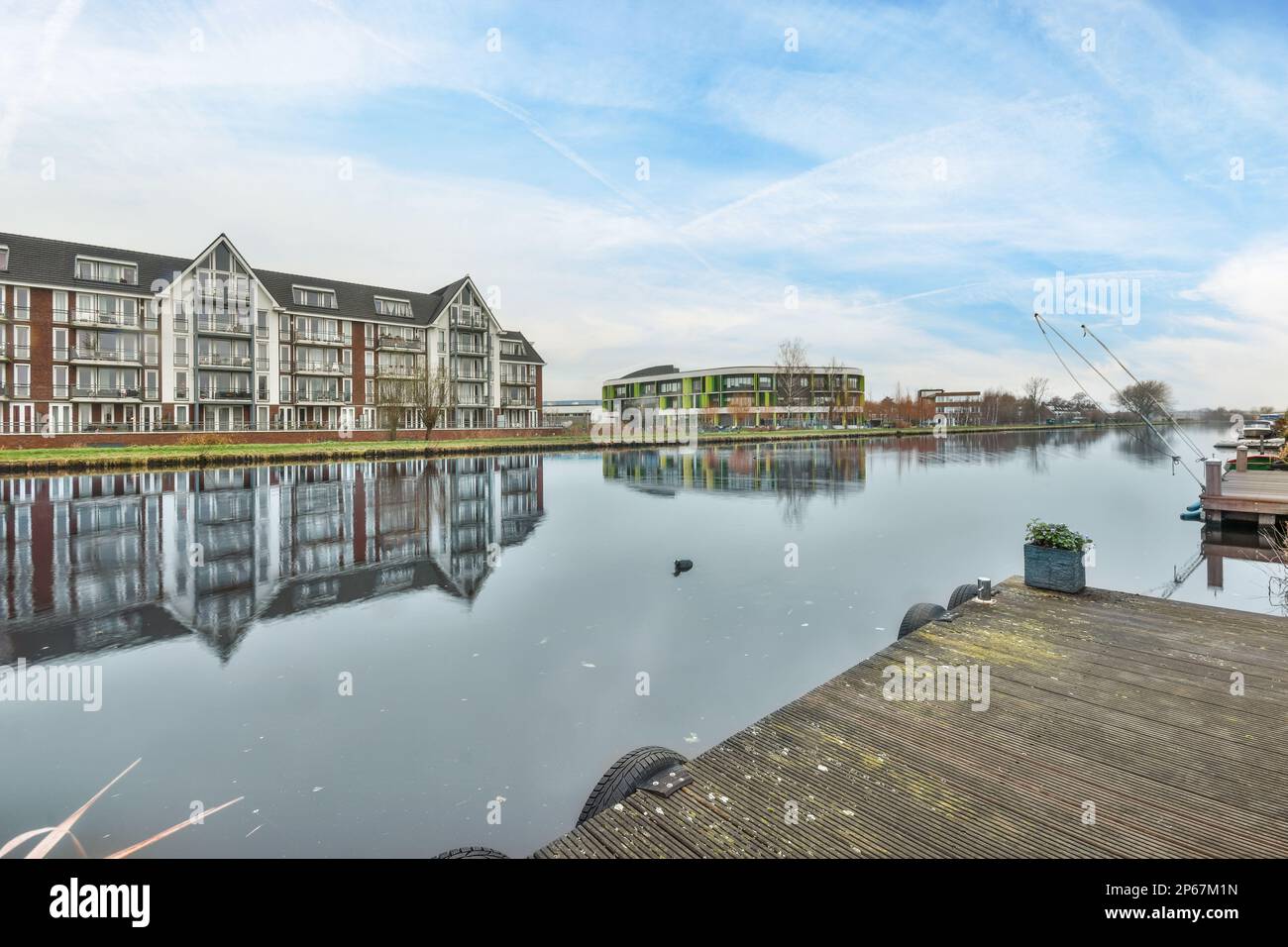 Amsterdam, Netherlands - 10 April, 2021: a lake with buildings in the ...