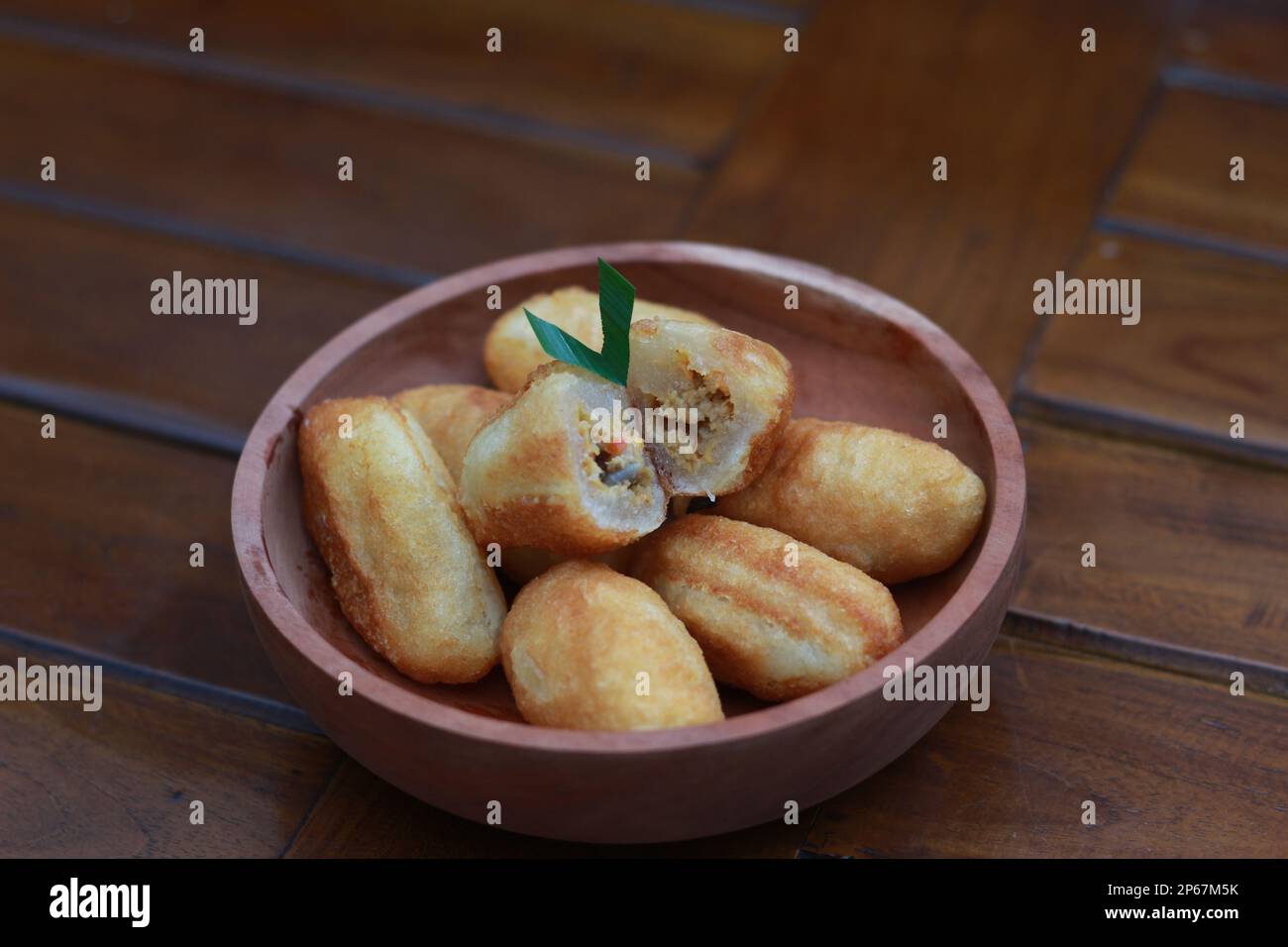 Comro or combro, a traditional Javanese snack made of deep fried grated ...