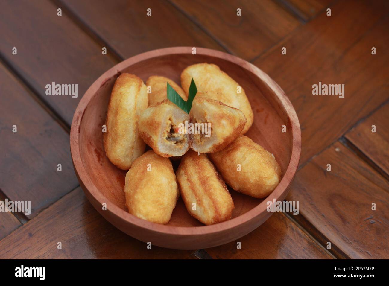 Comro or combro, a traditional Javanese snack made of deep fried grated ...