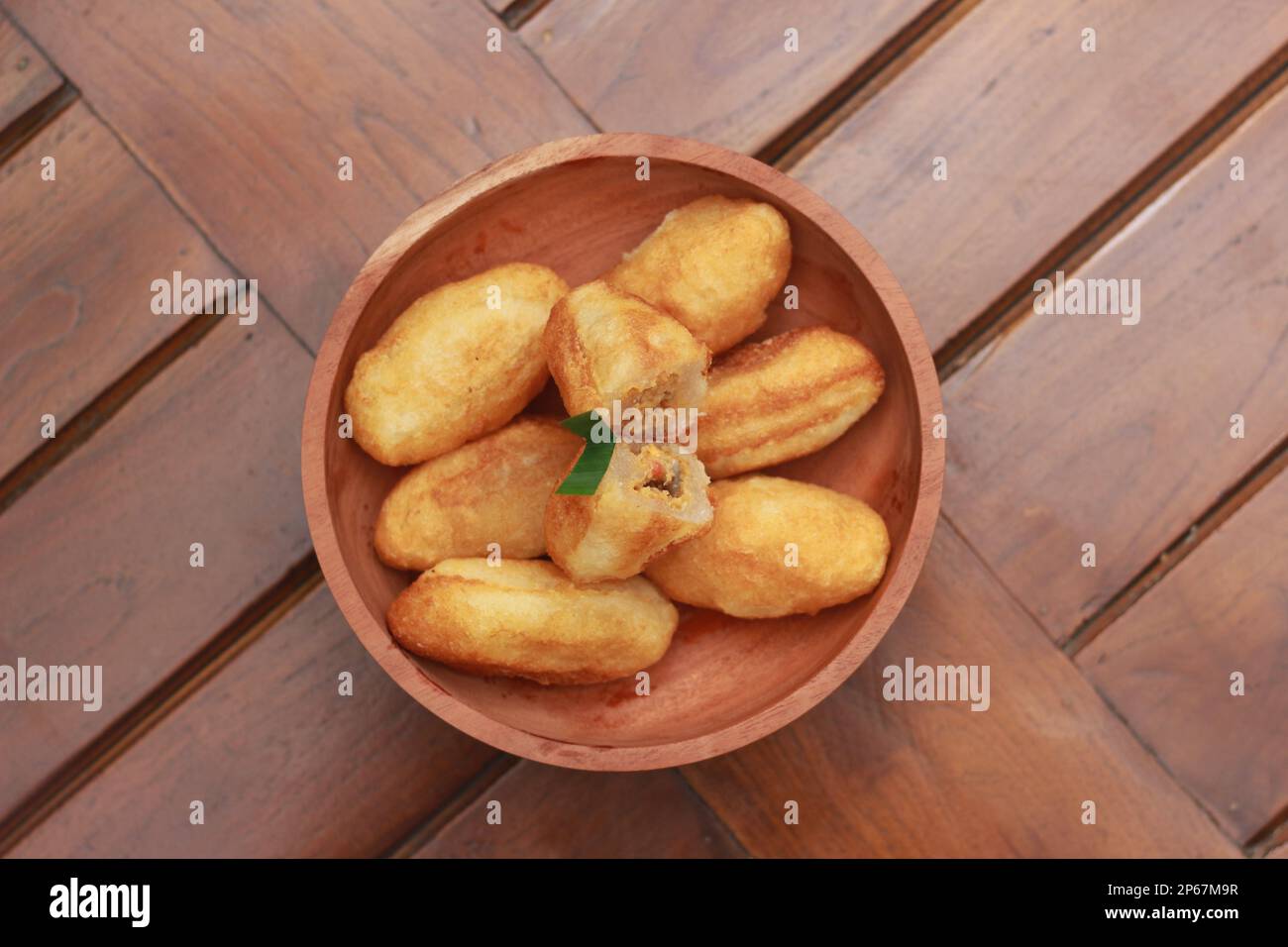 Comro or combro, a traditional Javanese snack made of deep fried grated ...