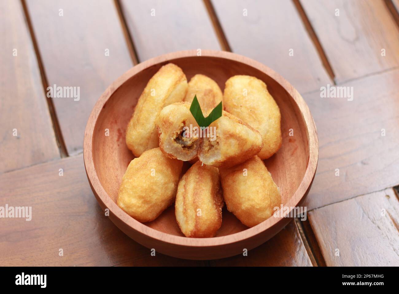 Comro or combro, a traditional Javanese snack made of deep fried grated ...