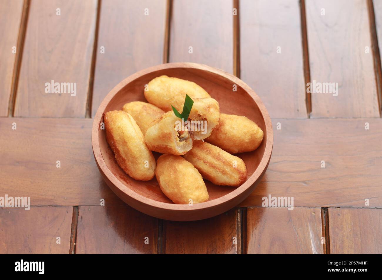Comro or combro, a traditional Javanese snack made of deep fried grated ...