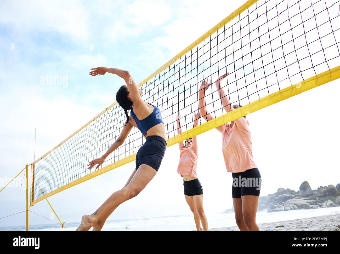 Female beach volleyball player jumping hi-res stock photography and ...