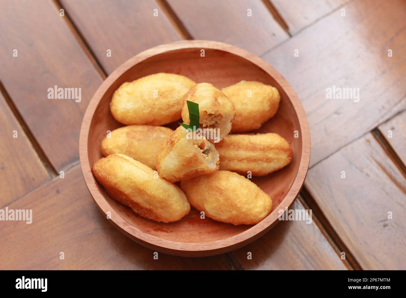 Comro or combro, a traditional Javanese snack made of deep fried grated ...