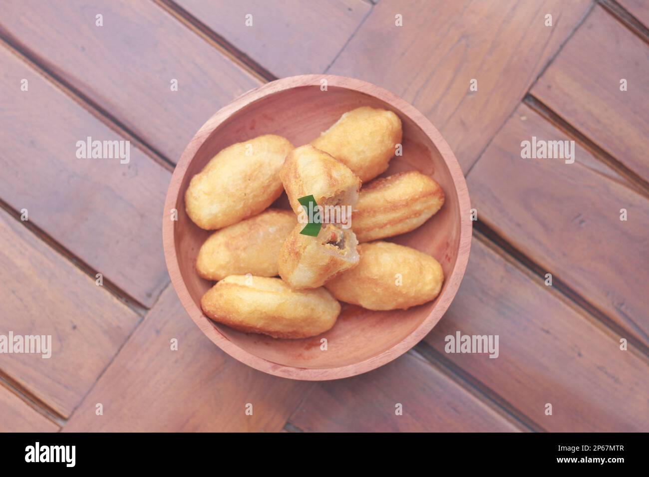 Comro or combro, a traditional Javanese snack made of deep fried grated ...