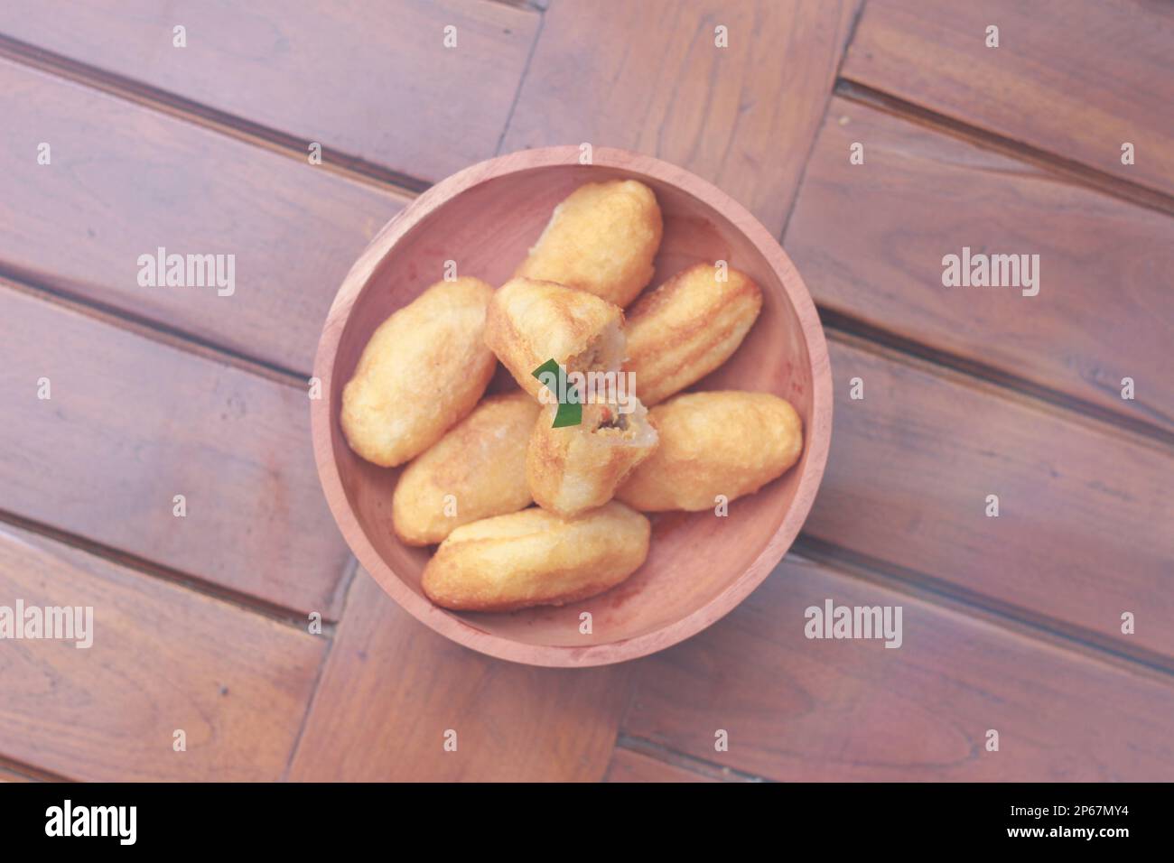 Comro or combro, a traditional Javanese snack made of deep fried grated ...