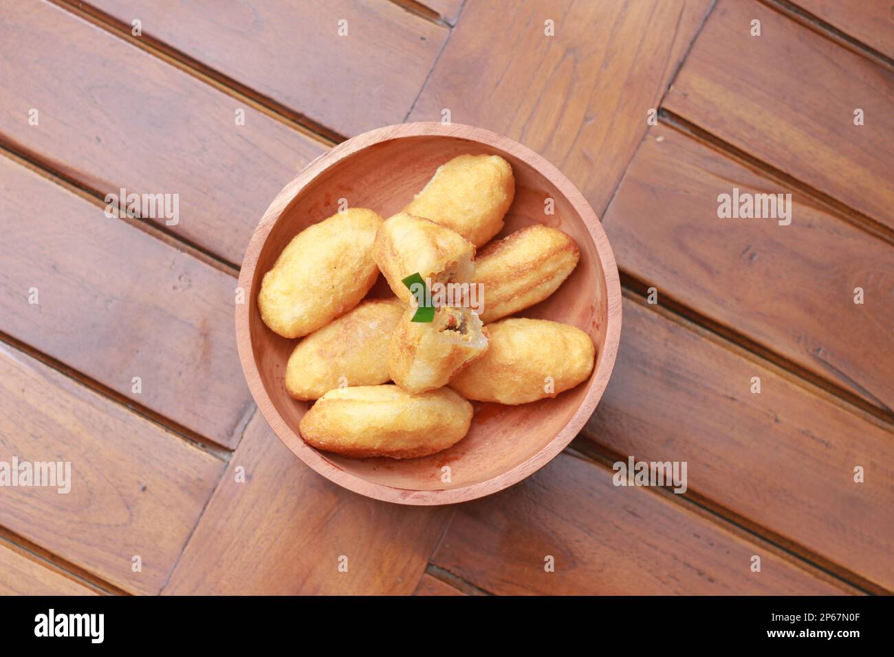 Comro or combro, a traditional Javanese snack made of deep fried grated ...