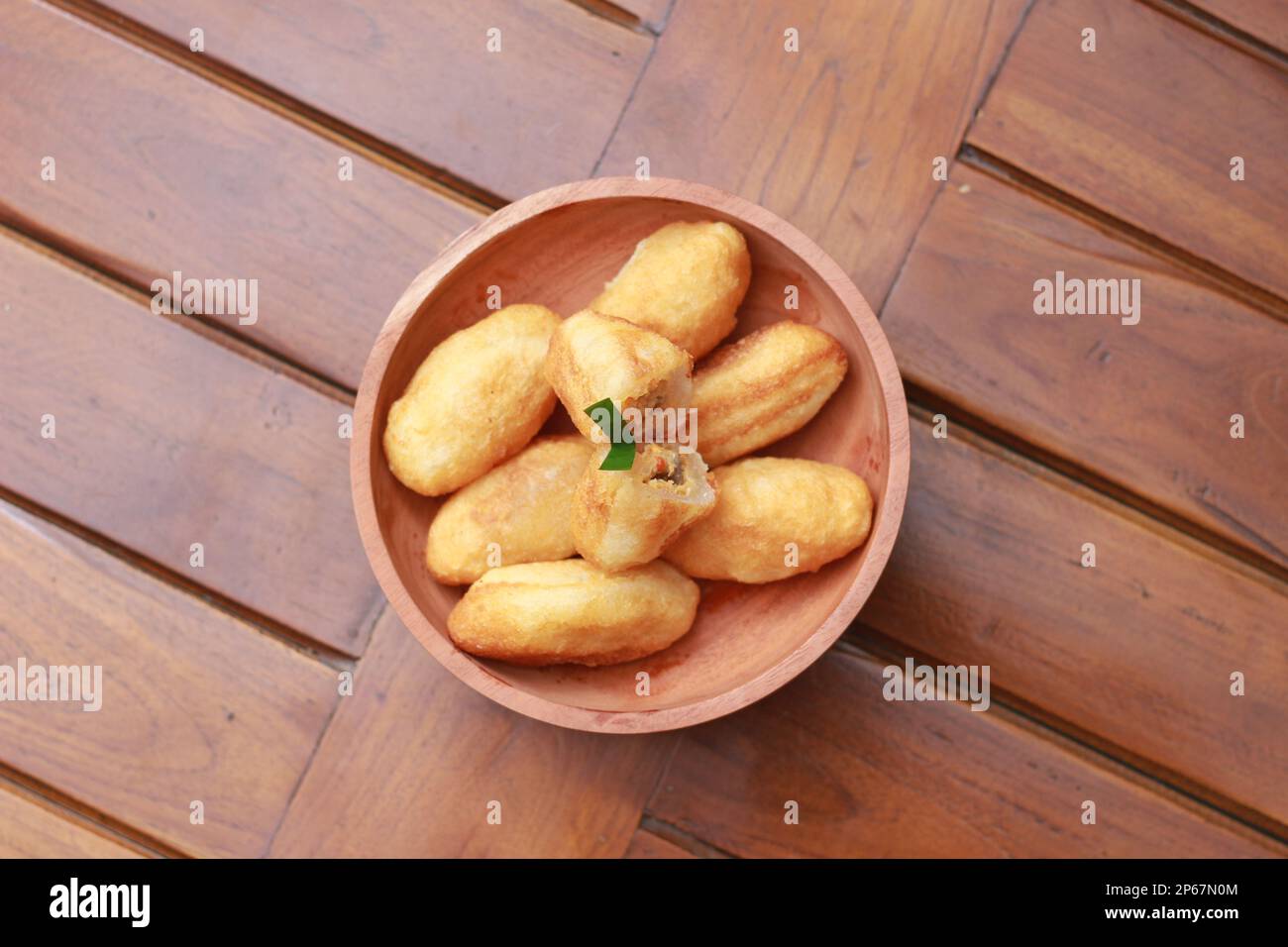 Comro or combro, a traditional Javanese snack made of deep fried grated ...