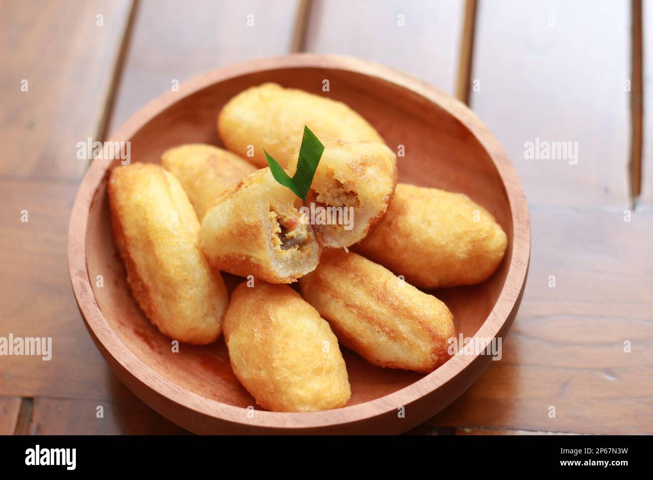 Comro or combro, a traditional Javanese snack made of deep fried grated ...