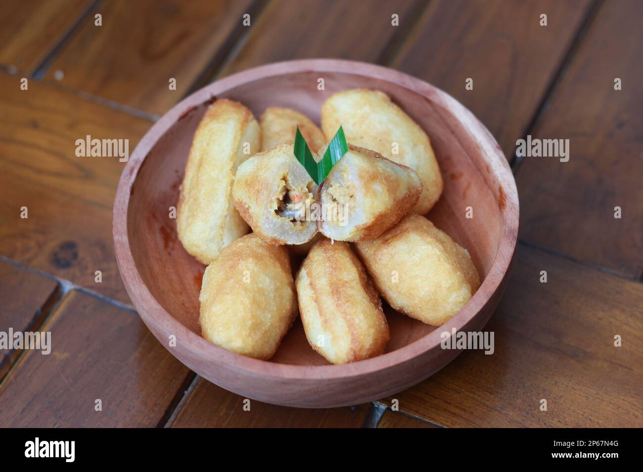 Comro or combro, a traditional Javanese snack made of deep fried grated ...