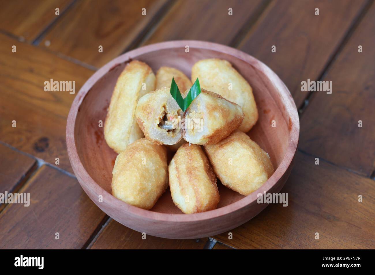 Comro or combro, a traditional Javanese snack made of deep fried grated ...