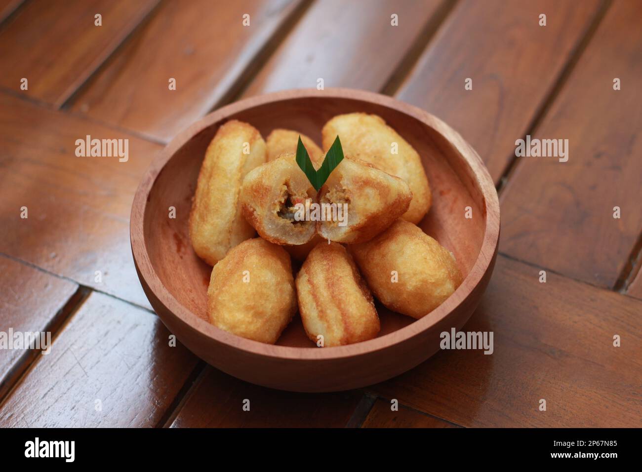 Comro or combro, a traditional Javanese snack made of deep fried grated ...
