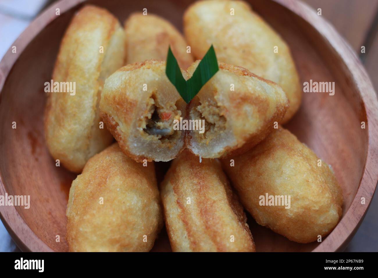 Comro or combro, a traditional Javanese snack made of deep fried grated ...