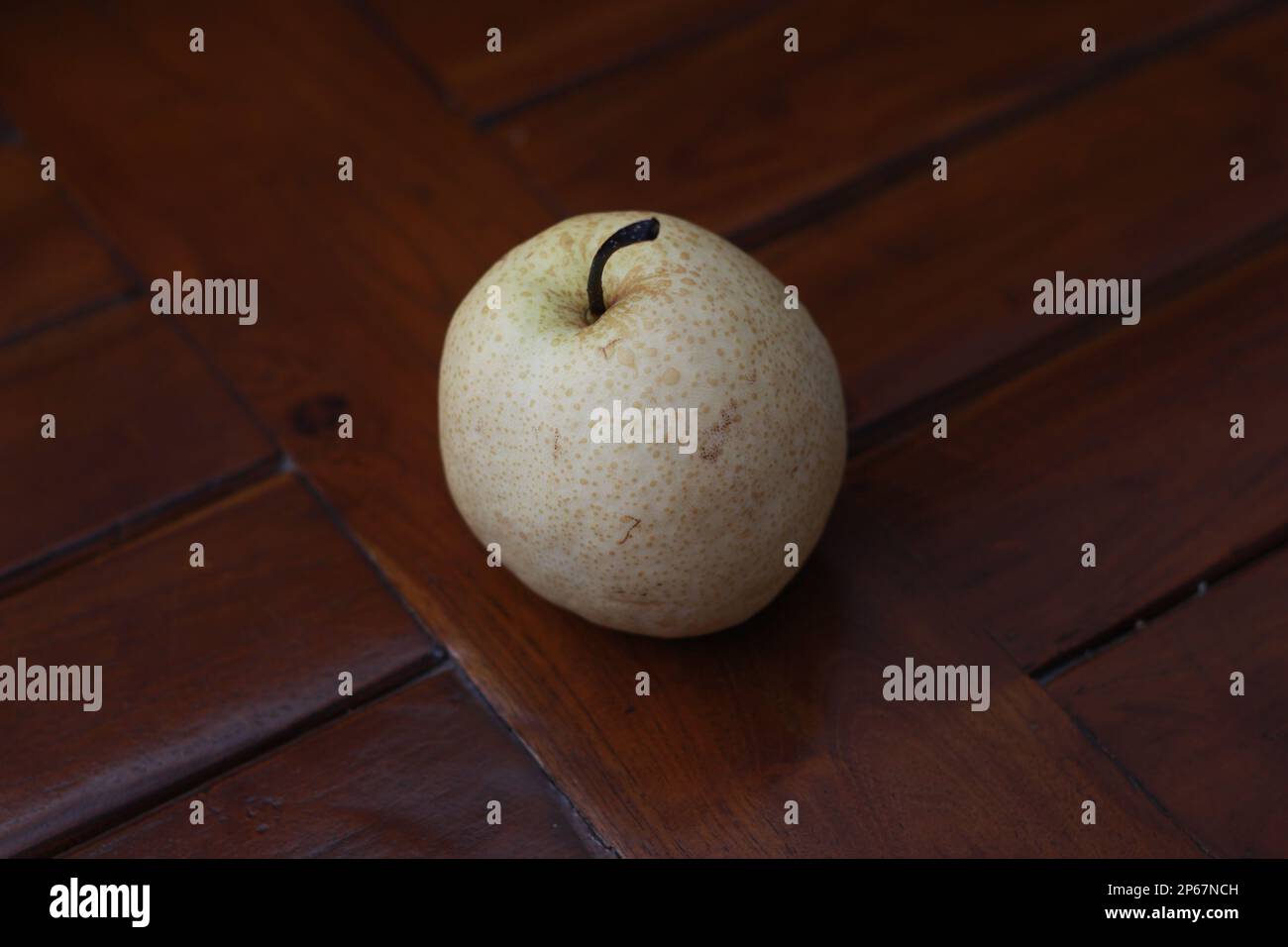 a close up of pear isolated natural pattern wood background. healthy ...