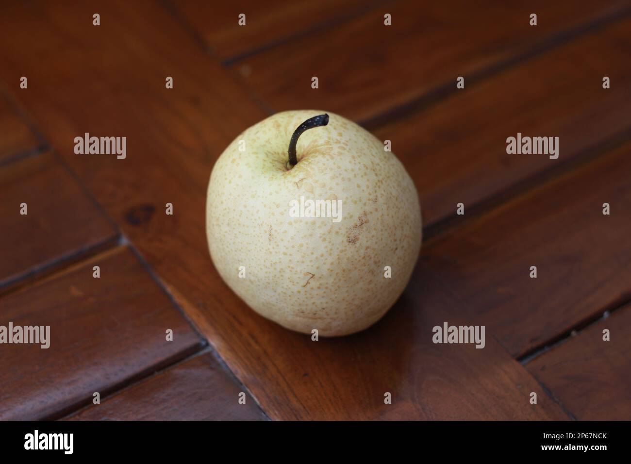 a close up of pear isolated natural pattern wood background. healthy ...