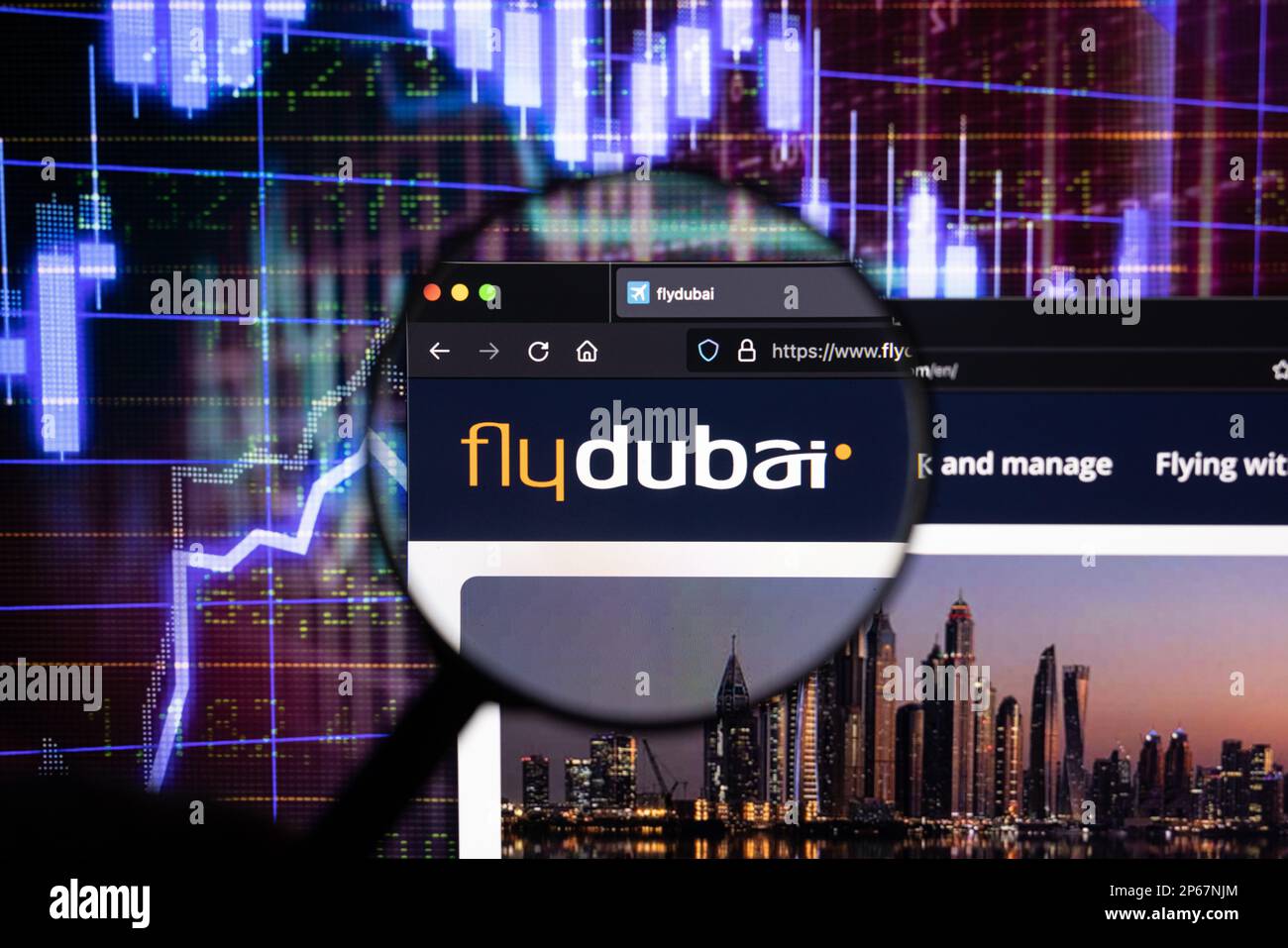 Fly Dubai airline company logo on a website with blurry stock market ...