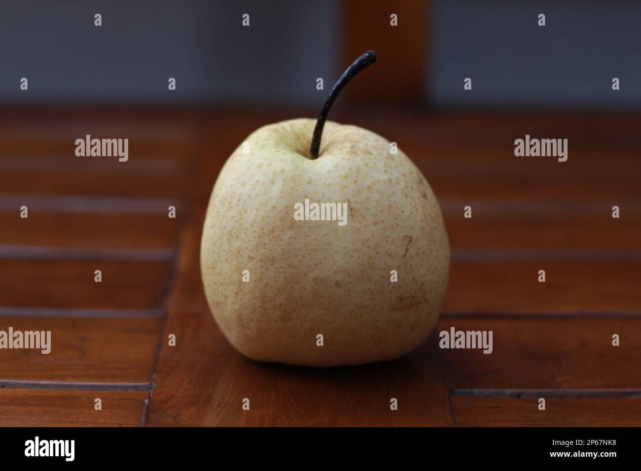a close up of pear isolated natural pattern wood background. healthy ...