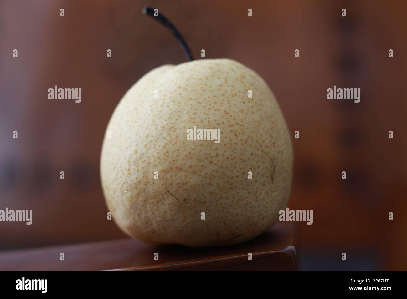 a close up of pear isolated natural pattern wood background. healthy ...