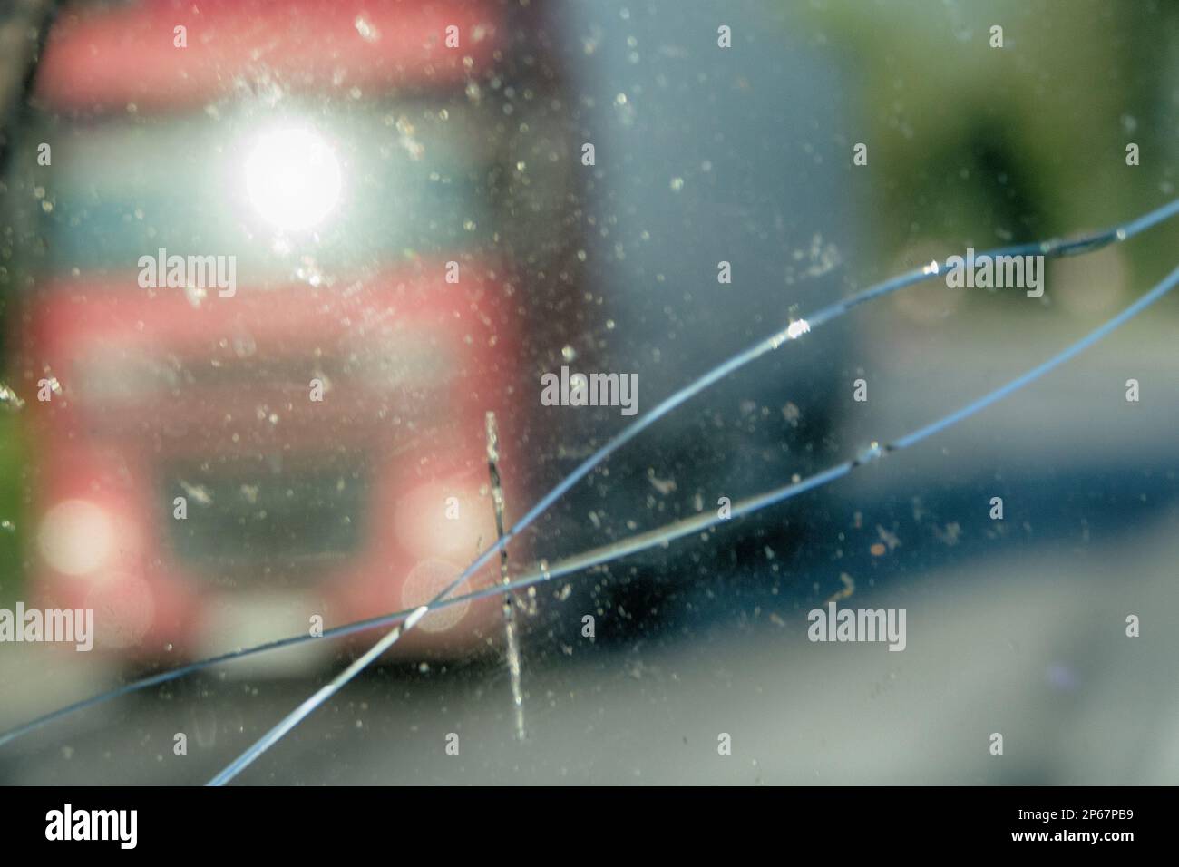 Highway through a broken windshield after encountering a truck with ...