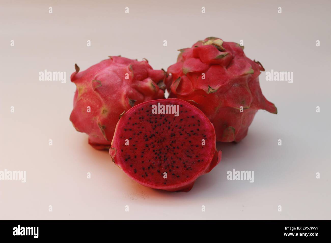 a close up of red dragon fruit isolated on white background. healthy ...