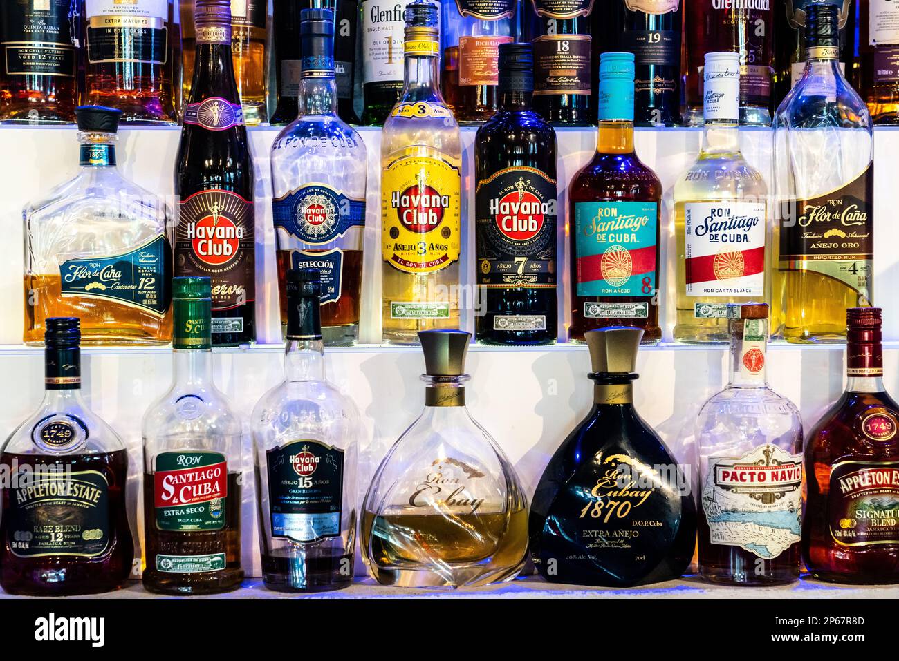 Lines of bottles of ubiquitous rum, Havana, Cuba, West Indies ...