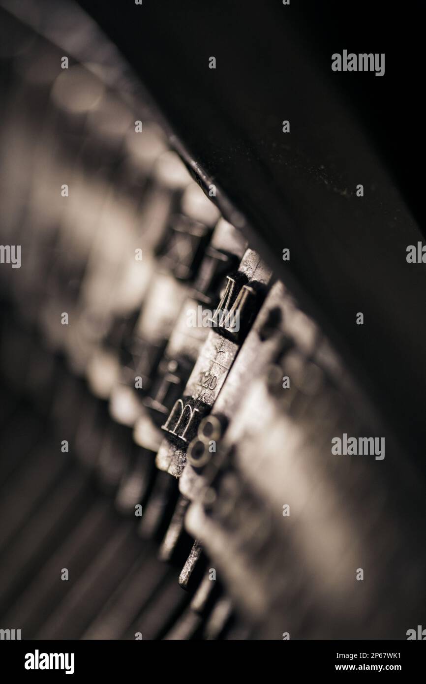 Closeup of old typewriter plates strikers strykers with letters and ...