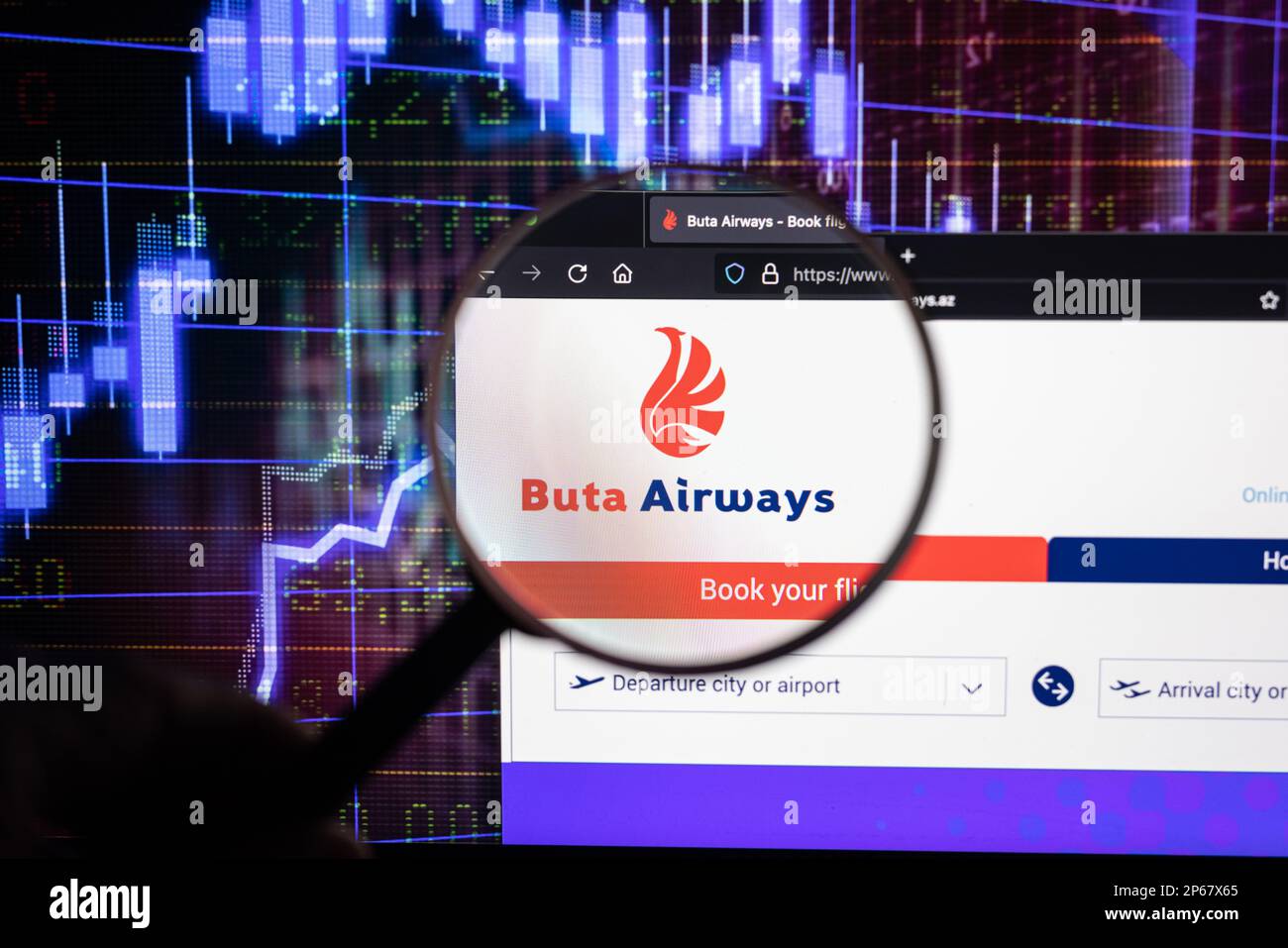 Buta Airways company logo on a website with blurry stock market developments in the background ...
