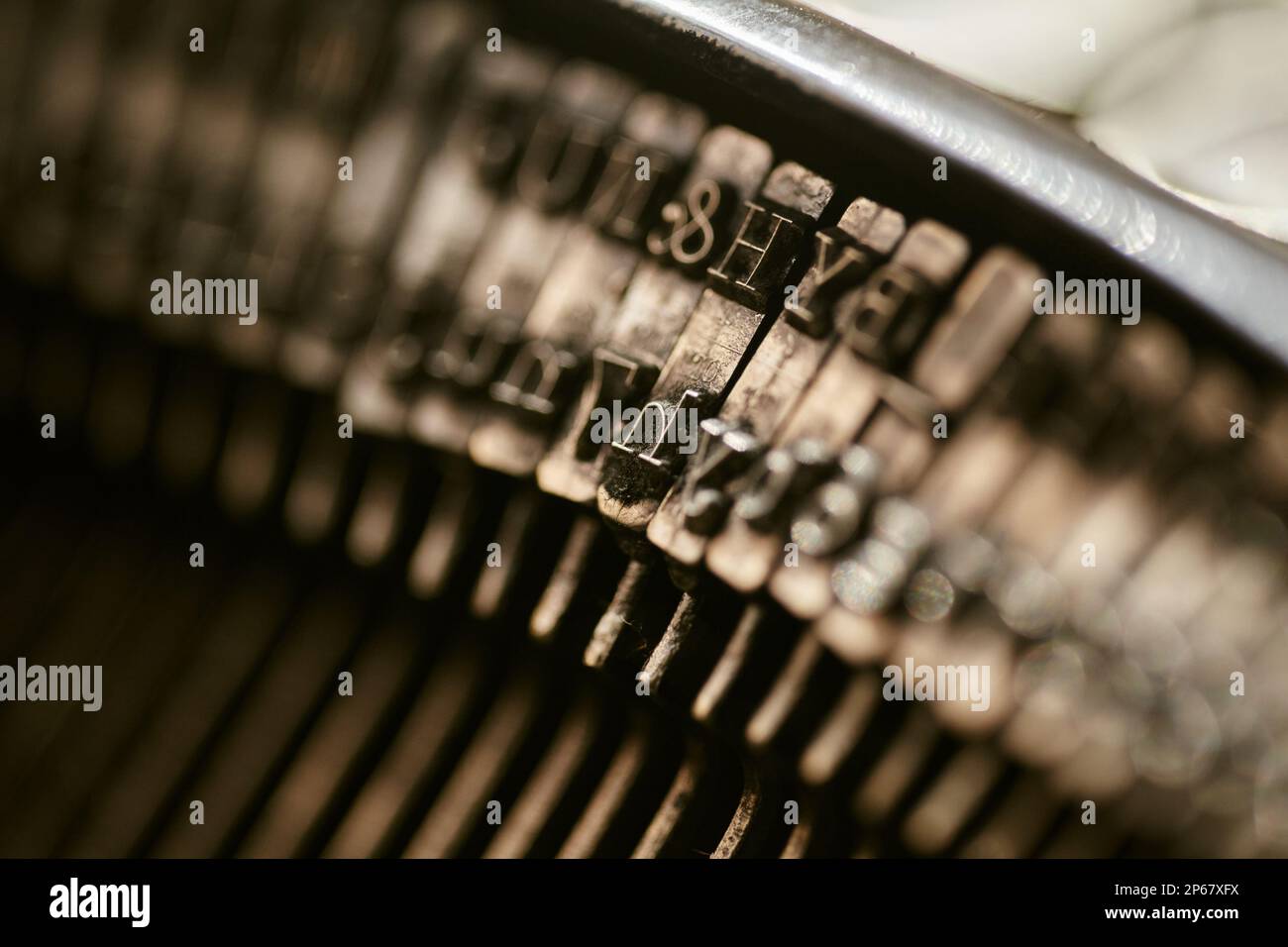Closeup of old typewriter plates strikers strykers with letters and ...