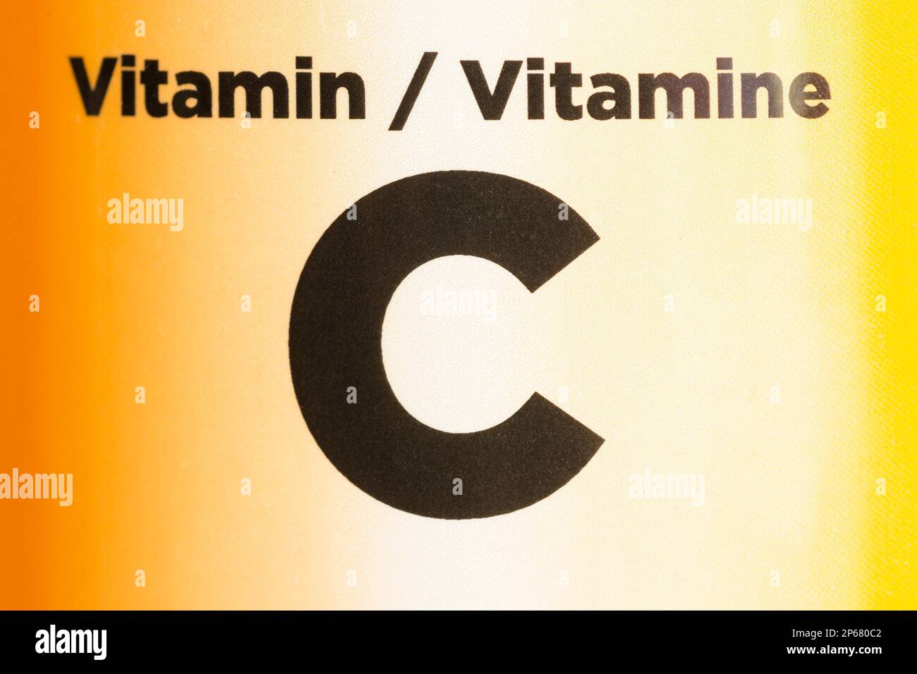 Vitamin C label on orange background Stock Photo - Alamy