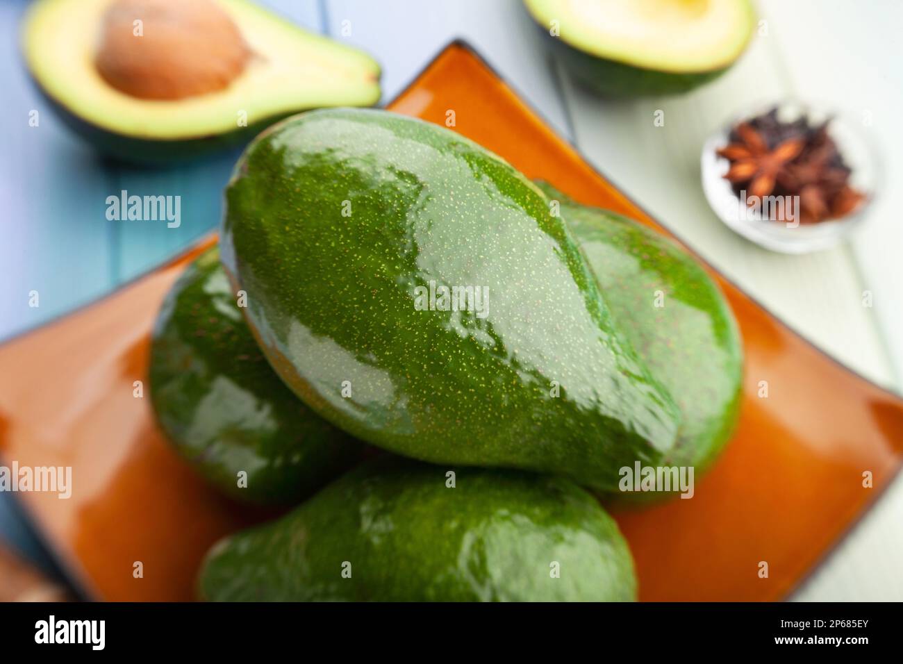 avocado group on wood background Stock Photo - Alamy