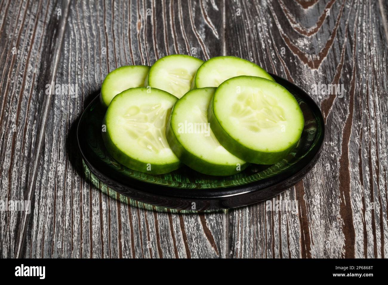 Closeup sliced cucumber on black hi-res stock photography and images ...