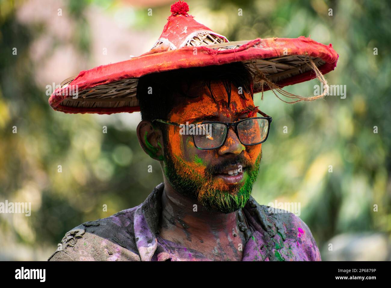Reveller smear with 'Gulal' or coloured powder to celebrate Holi, the ...