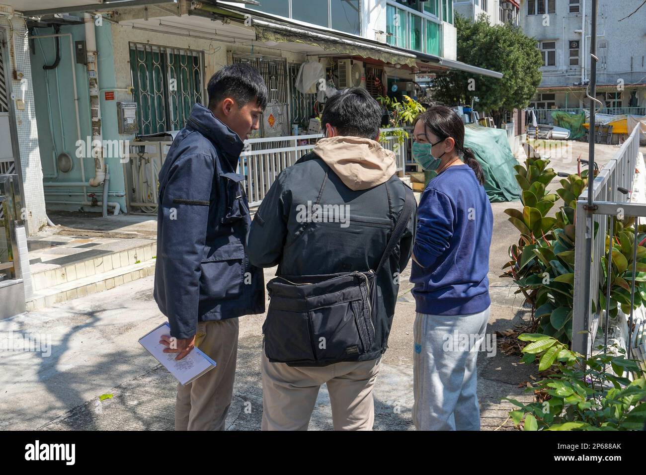 Police officers conduct questionnaire with residents in Lung Mei ...