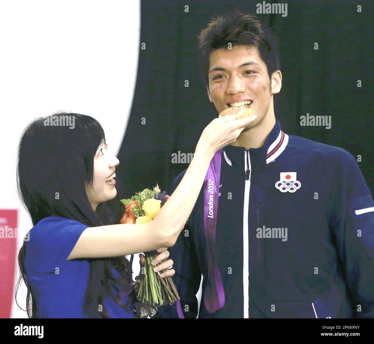 Ryota Murata of Japan (R) and his wife Yoshiko celebrate with gold ...